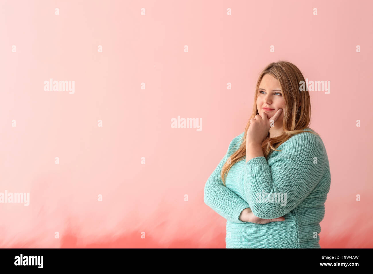 Beautiful plus size girl on color background. Concept of body ...