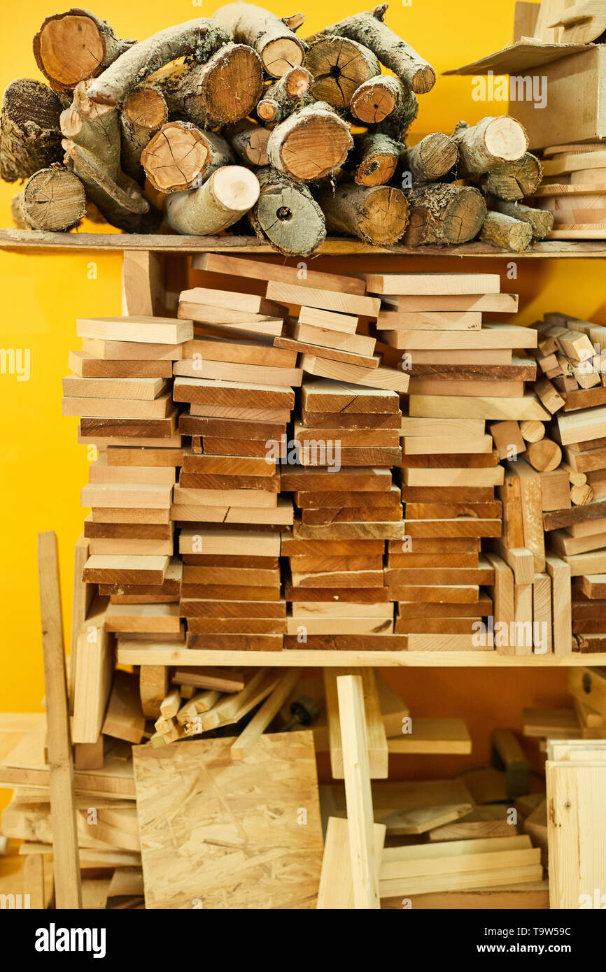 Background image of wood stand with branches and boards in joinery shop ...