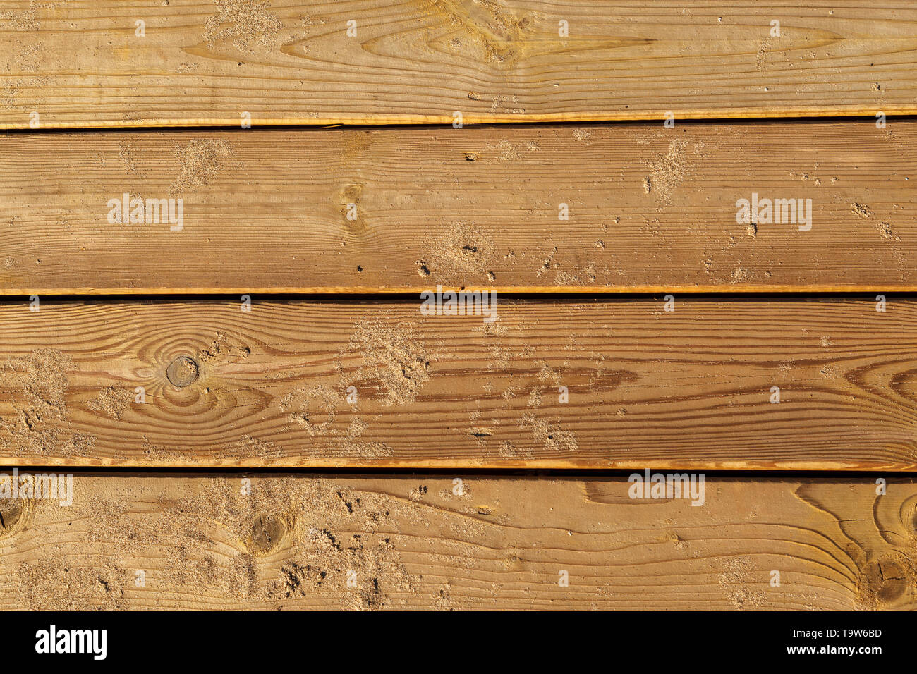 Wooden background. Boards in sand. Wooden path on the sandy beach ...