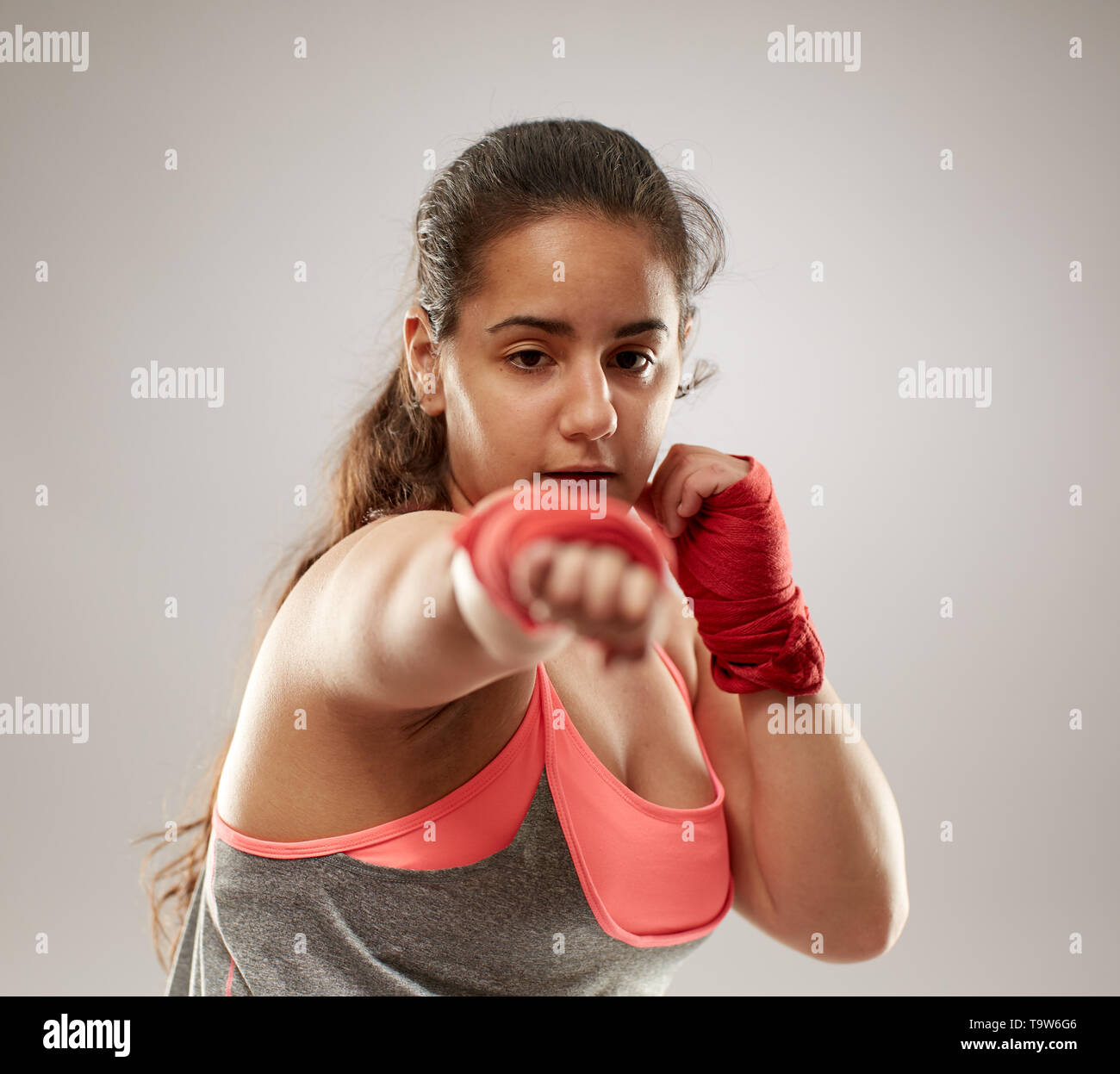 Boxer girl in hand wraps doing shadow boxing Stock Photo - Alamy
