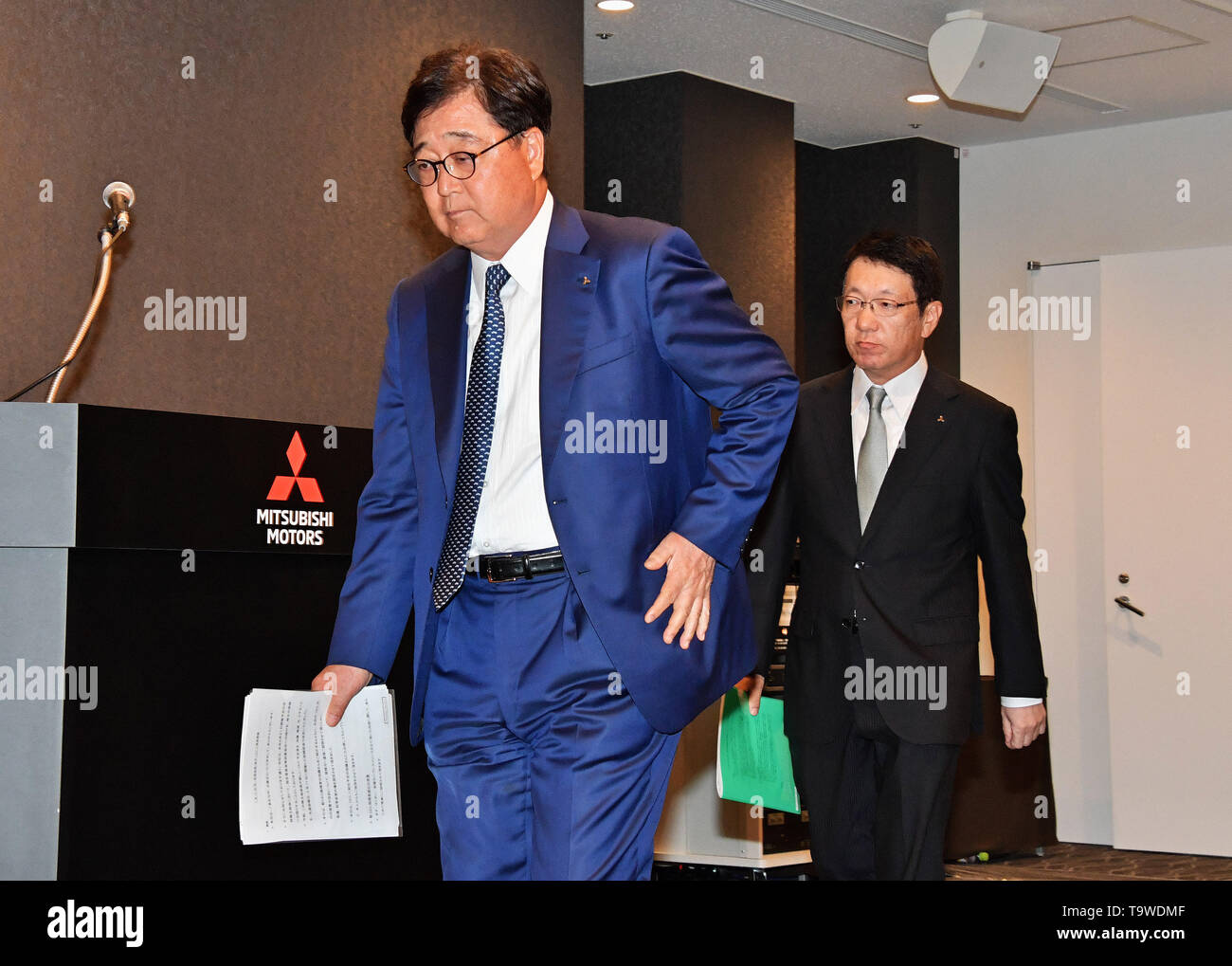 Chairman of Mitsubishi Motors Osamu Masuko (L) and New CEO Takao Kato ...