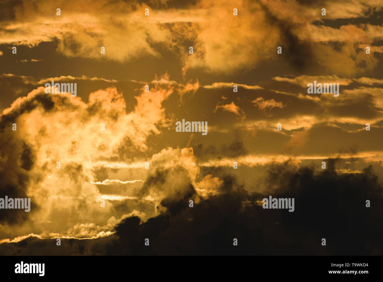 Dramatic sunset sky with orange colored clouds Stock Photo - Alamy