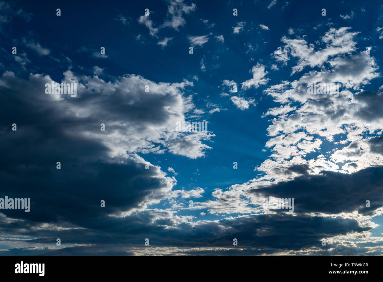 Deep blue sky with clouds Stock Photo - Alamy
