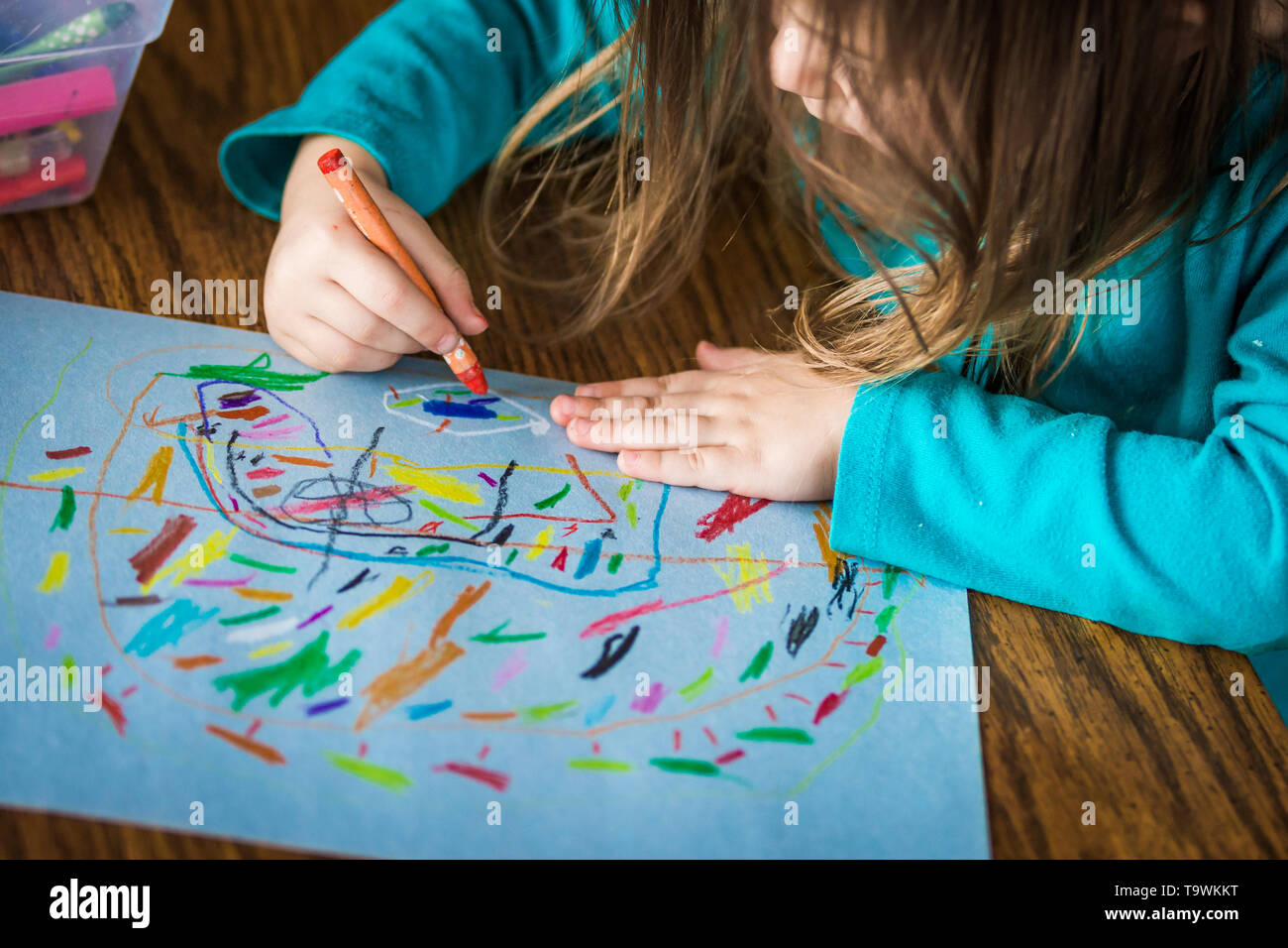 Little preschool age girl creates creative abstract picture with lots ...