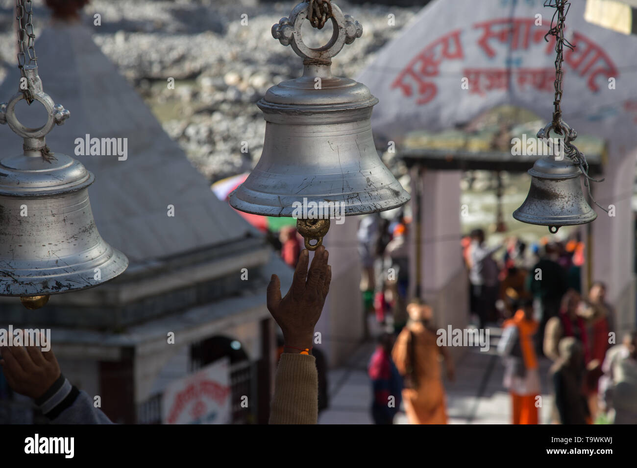 Close up of Large silver temple bells at the temple of Goddess Ganga in ...