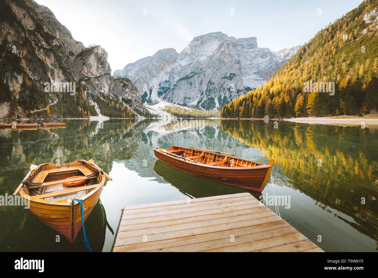 Beautiful view of traditional wooden rowing boats on scenic Lago di ...