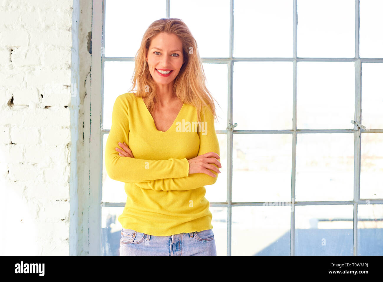 Close-up portrait shot of beautiful mature woman with toothy smile ...