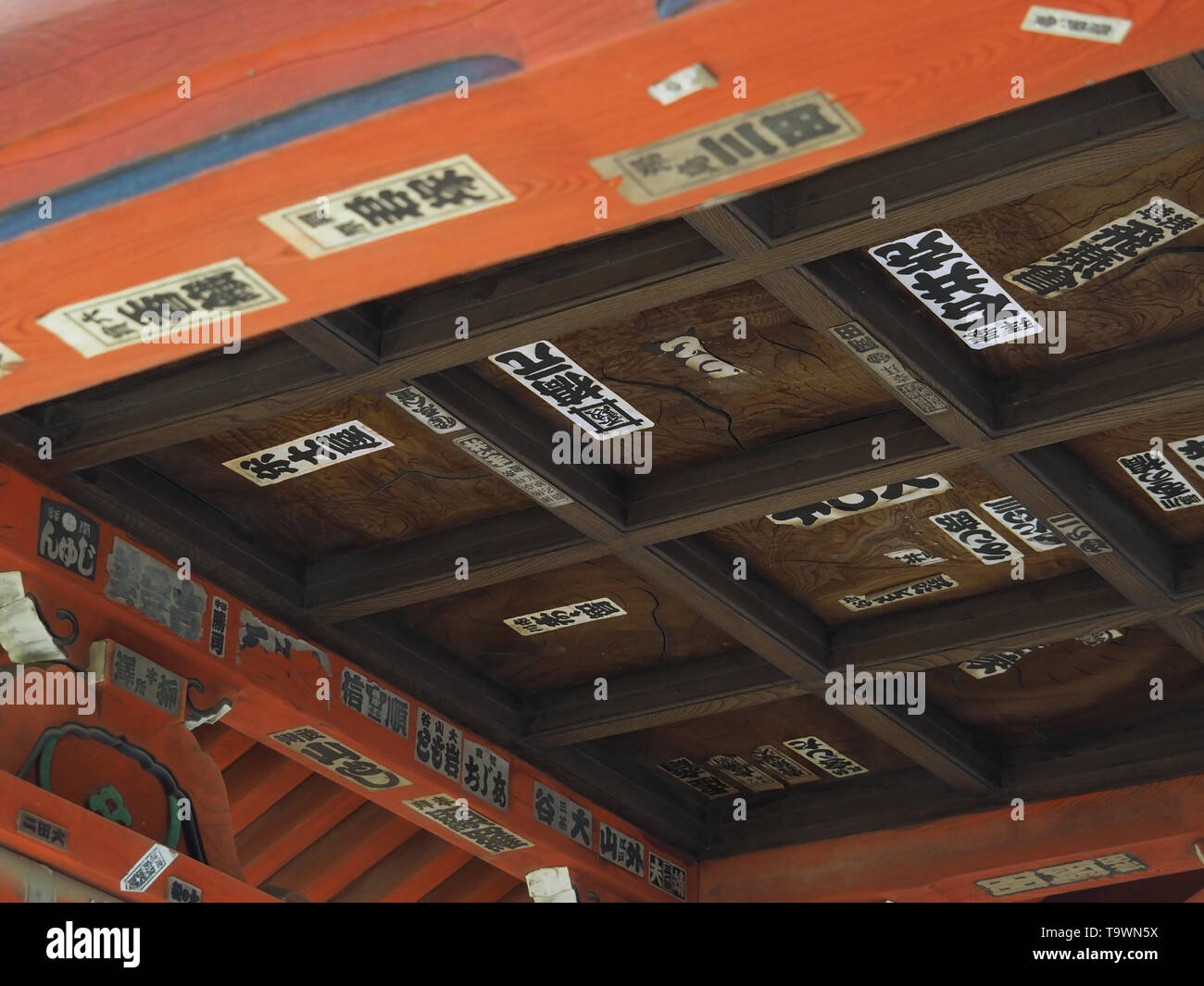 temple ceiling plastered with talismans at the nezu shrine in toyko ...