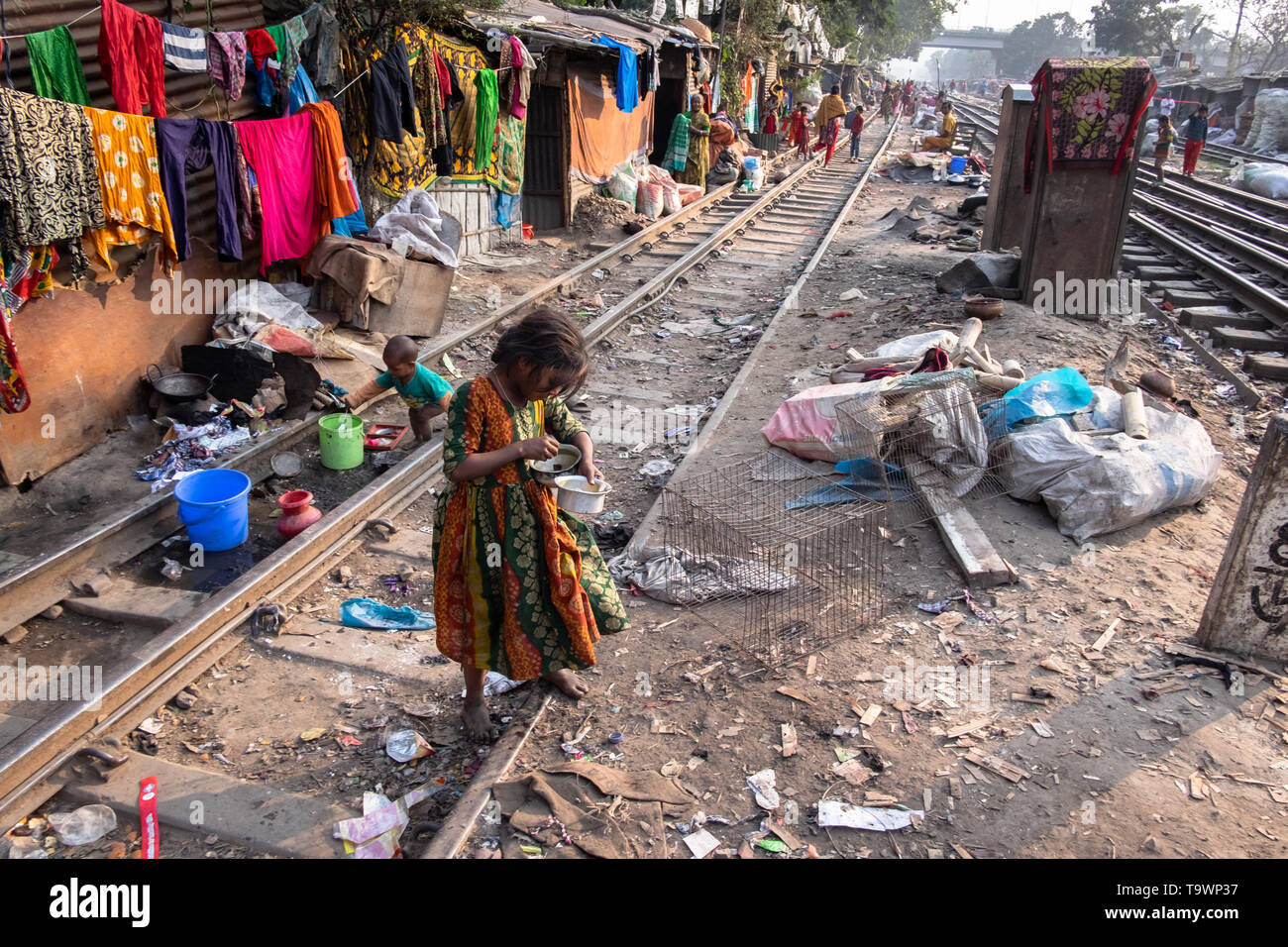 Children are seen as they play in the railway slum in Dhaka, Bangladesh ...