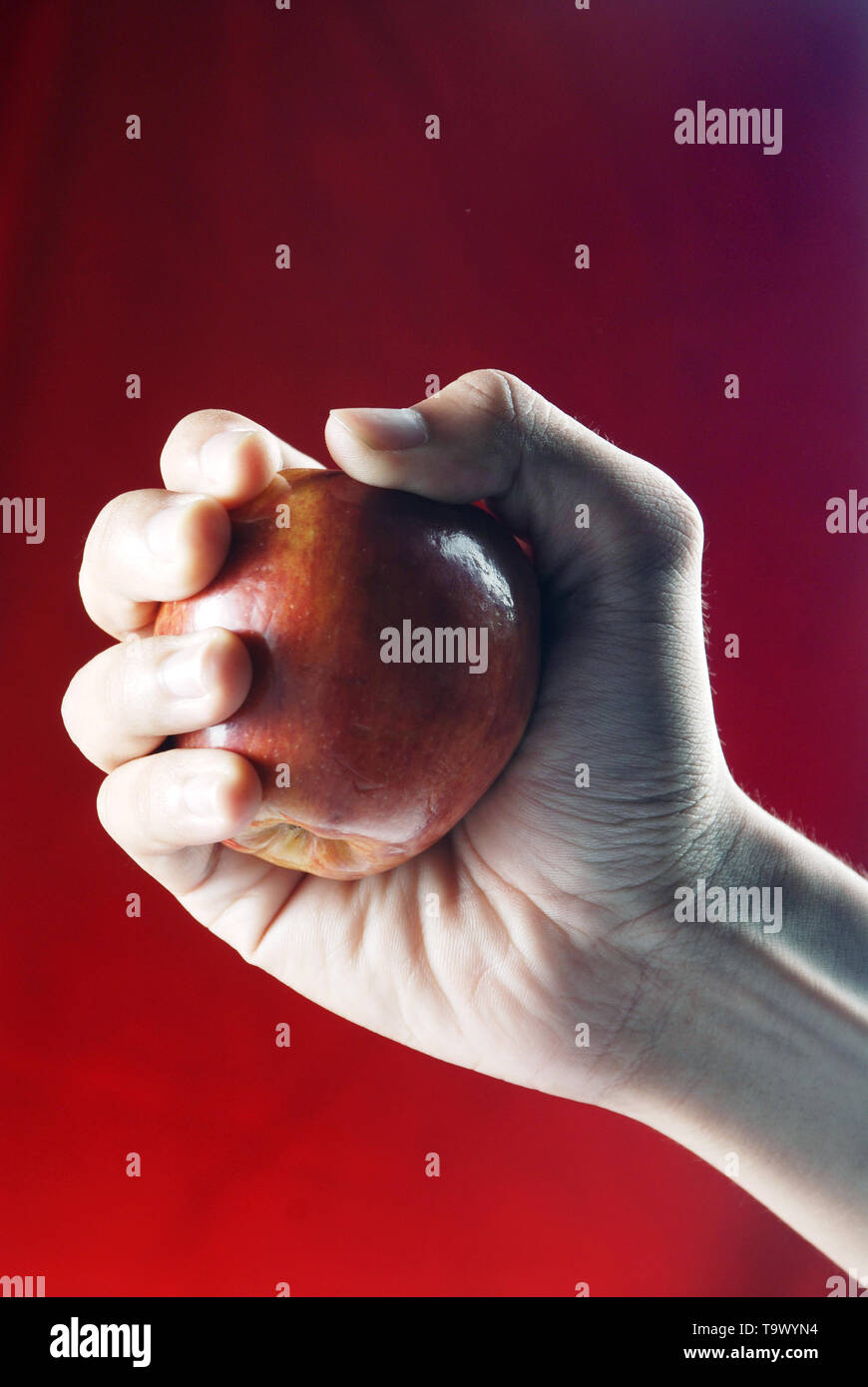 hand griping an apple Stock Photo - Alamy
