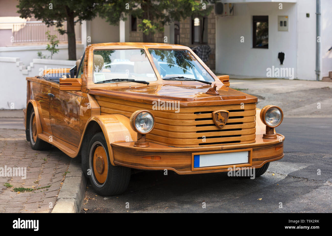 A large convertible with a wooden body made of different types of wood ...