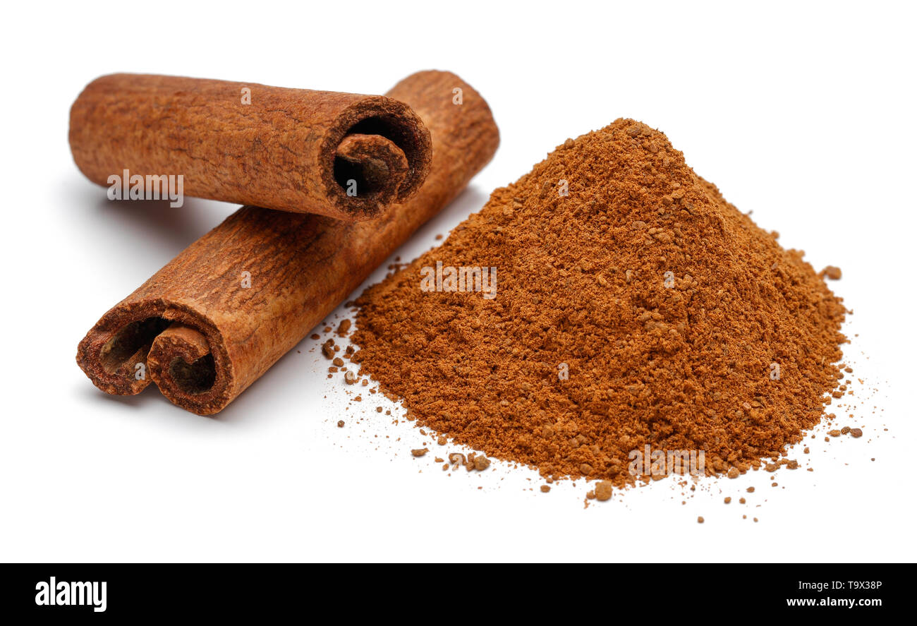 Cinnamon sticks and powder isolated on white background Stock Photo - Alamy