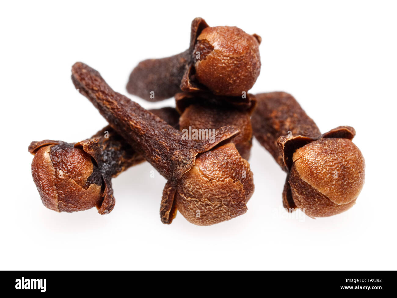Dry clove buds isolated on white background Stock Photo - Alamy