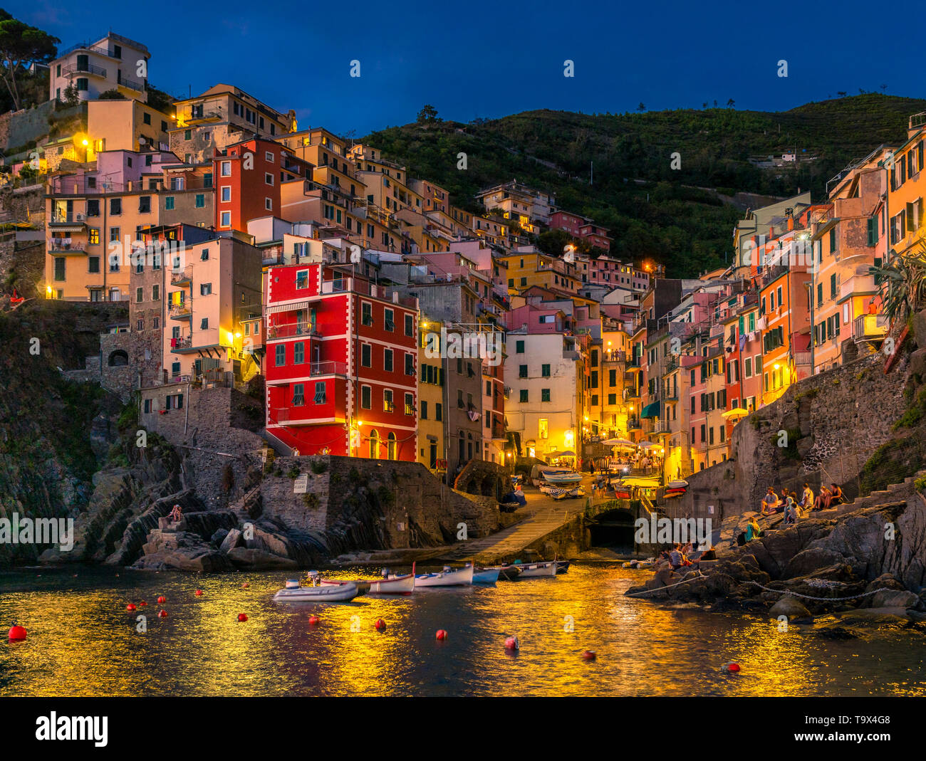 Fishing village Riomaggiore at night, Cinque Terre, La Spezia, Liguria ...