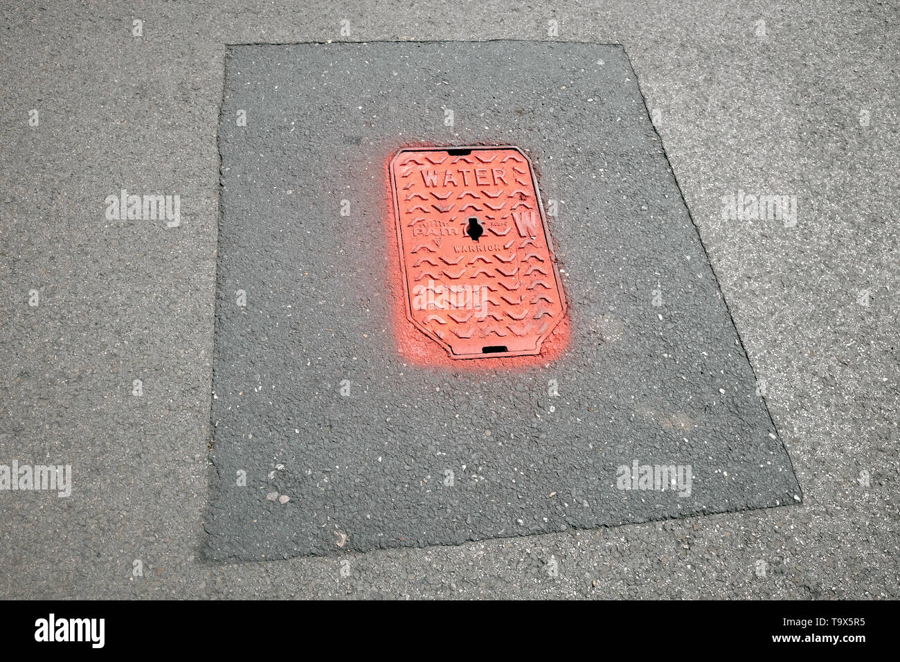 May 2019 - Coral colored pavement cast iron covers Stock Photo - Alamy