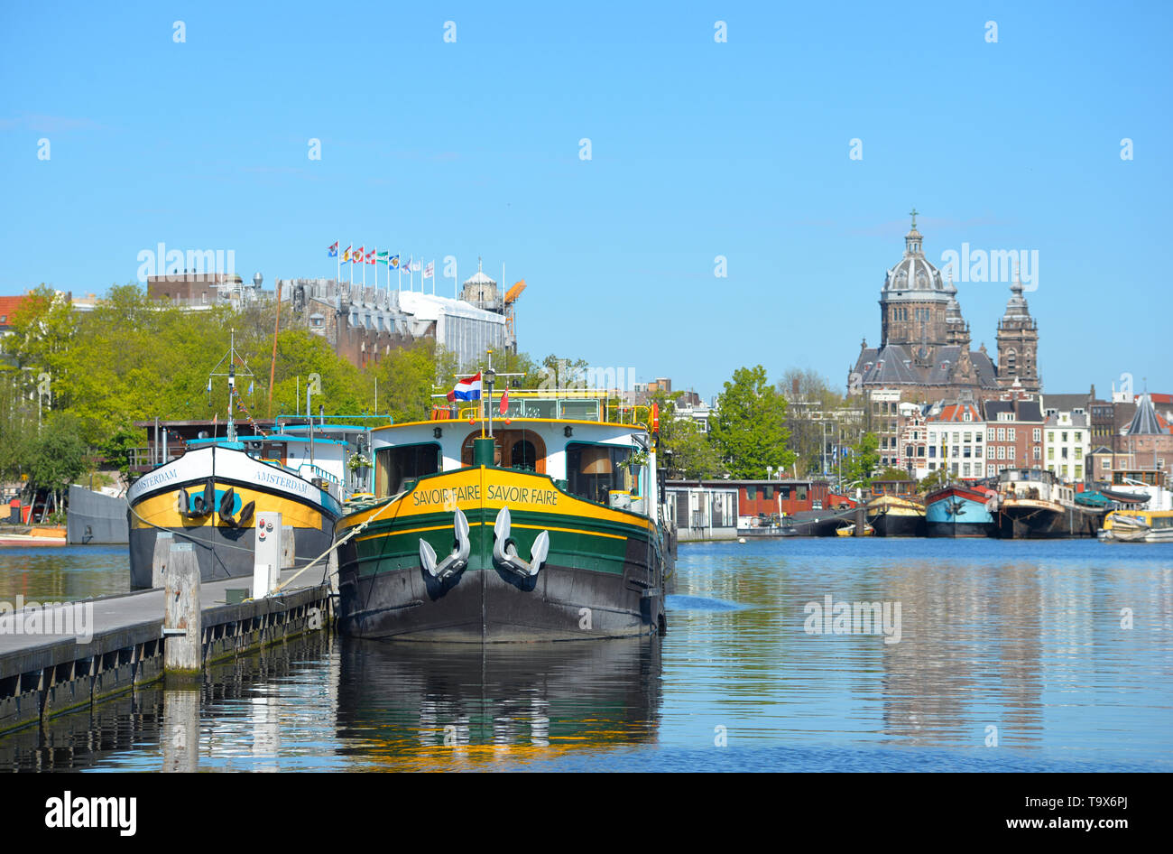 Dutch barges moored at Oosterdok, Amsterdam, Netherlands Stock Photo ...