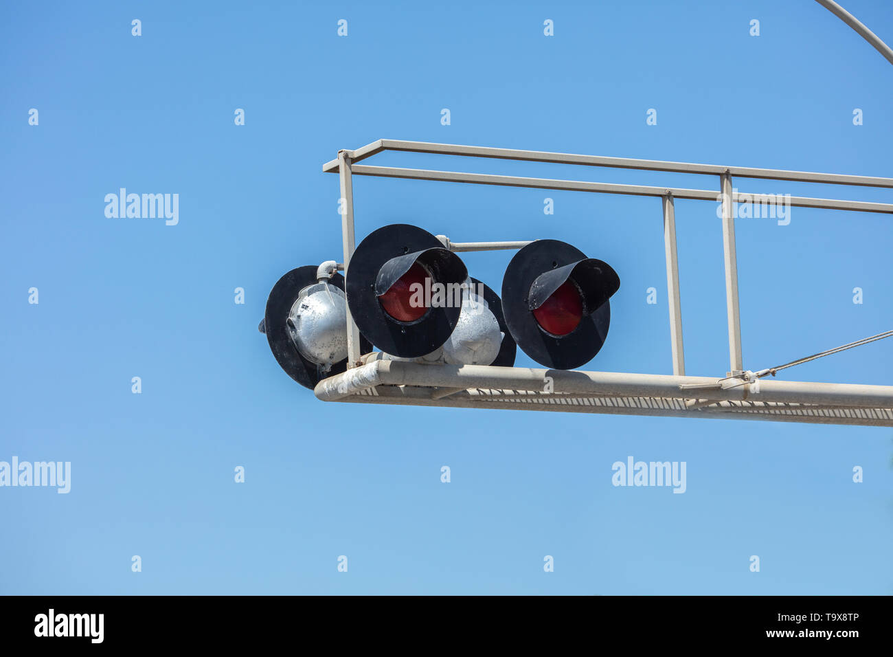 Railroad crossing light and barrier post with four lights and ...