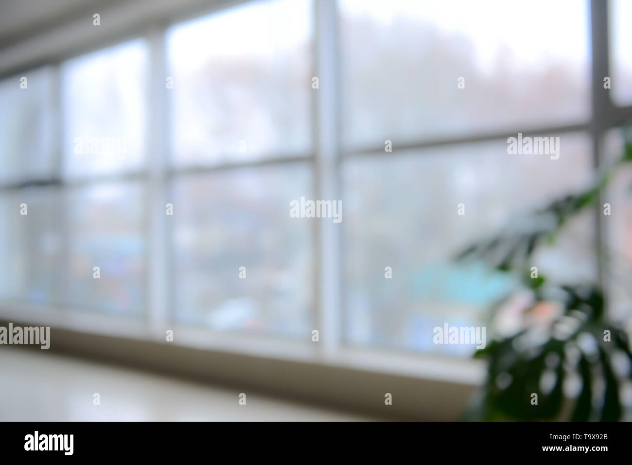 Blurred room with big window Stock Photo - Alamy