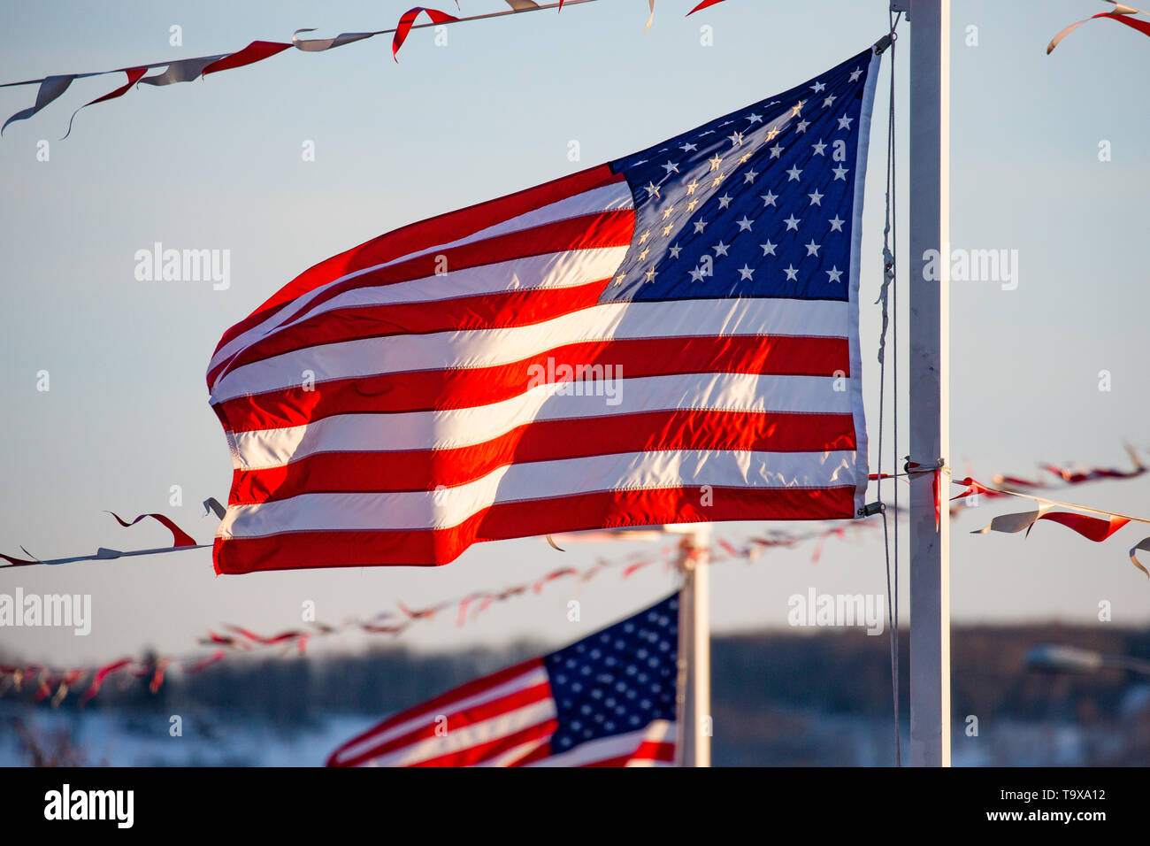 Two USA flags in motion from the wind Stock Photo - Alamy