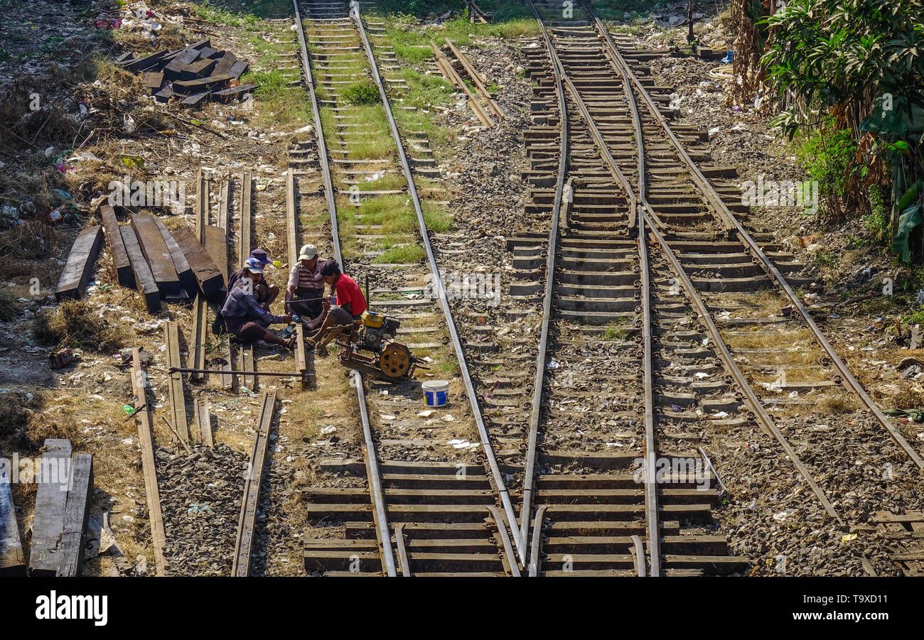 Yangon, Myanmar - Feb 9, 2017. People working on the rail track in ...