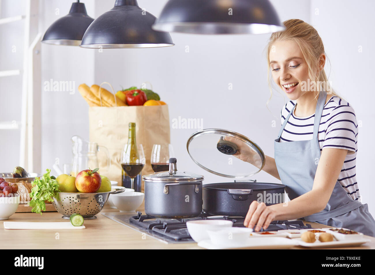 Young Woman Cooking in the kitchen. Healthy Food Stock Photo - Alamy