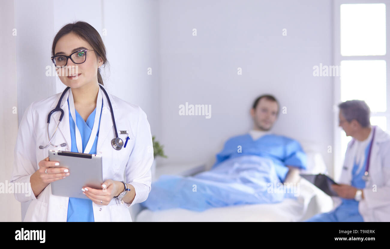 Doctor checking heart beat of patient in bed with stethoscope Stock ...