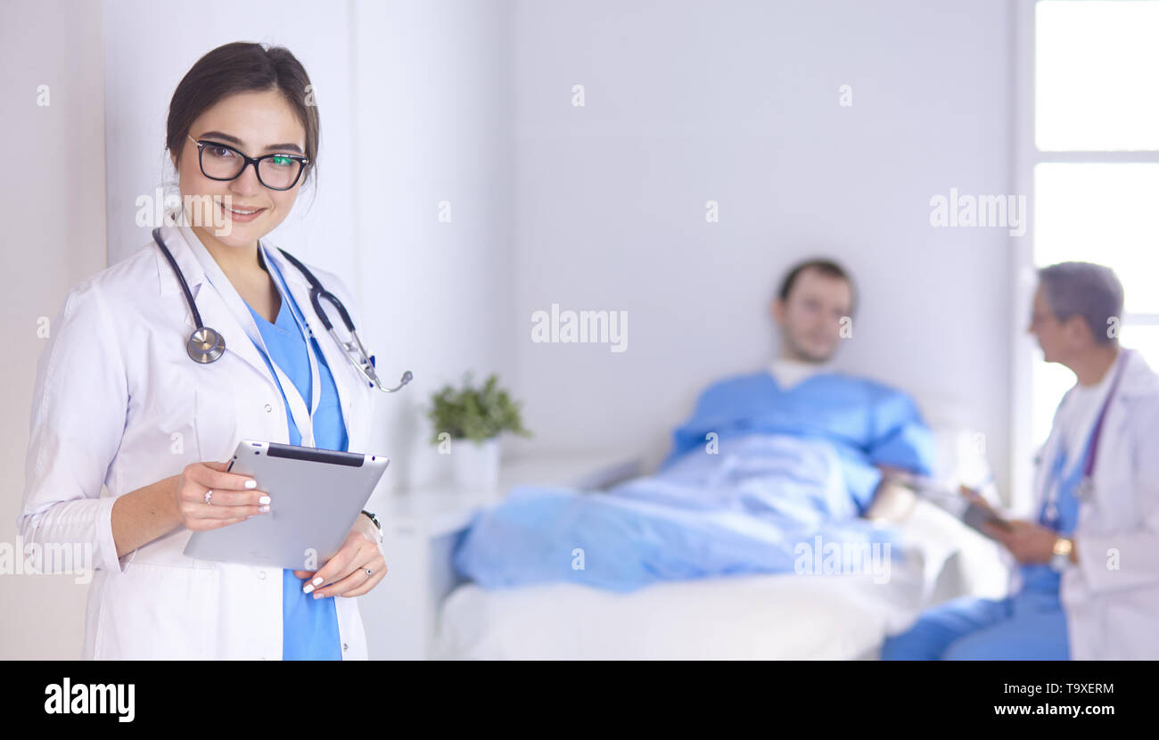 Doctor checking heart beat of patient in bed with stethoscope Stock ...