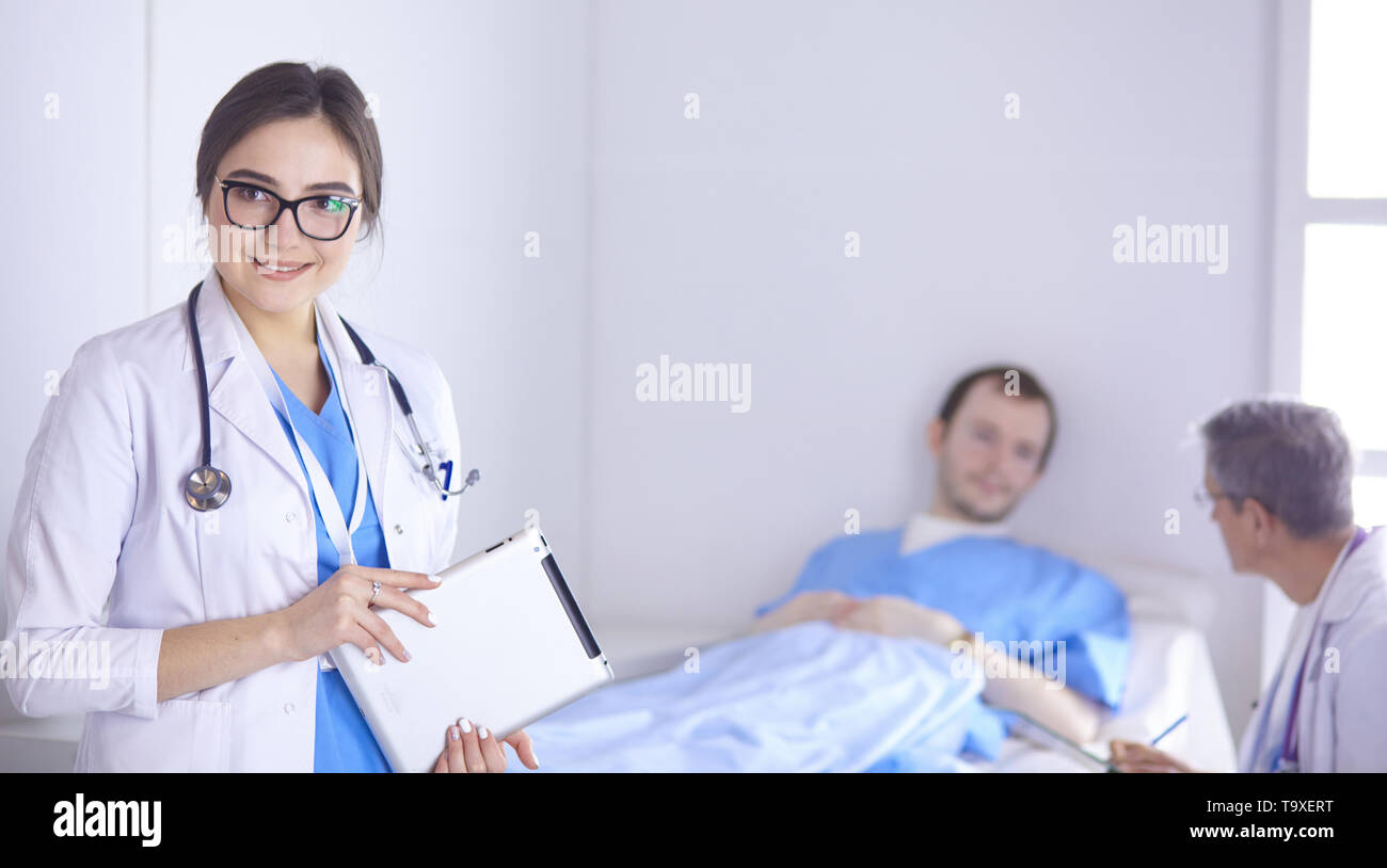 Doctor checking heart beat of patient in bed with stethoscope Stock ...