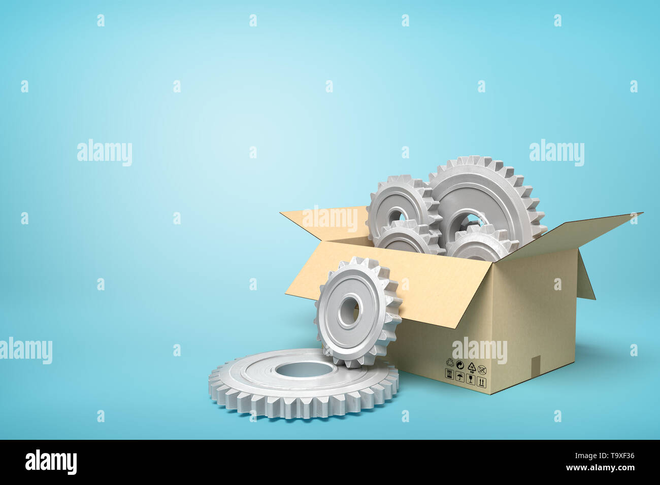 3d rendering of grey metal cogwheels in carton box on blue background ...