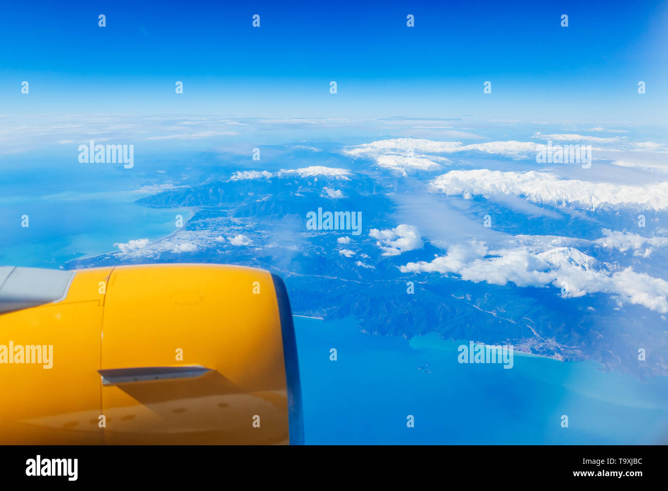 Plane window view of Egypt surrounded by sea, blue sky and airplane ...