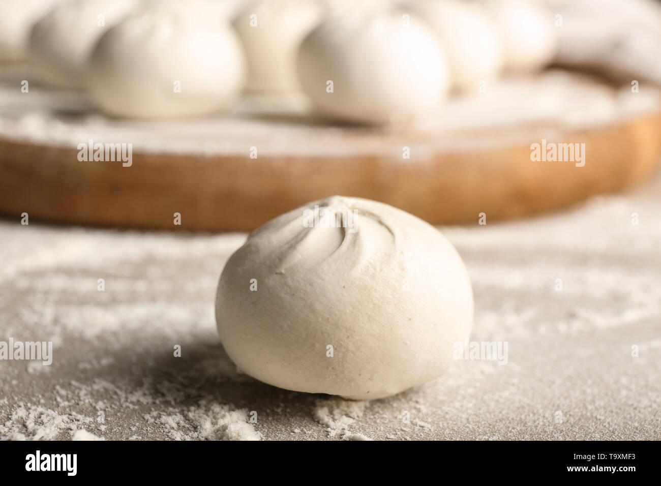 Raw Chinese dumpling on table Stock Photo - Alamy