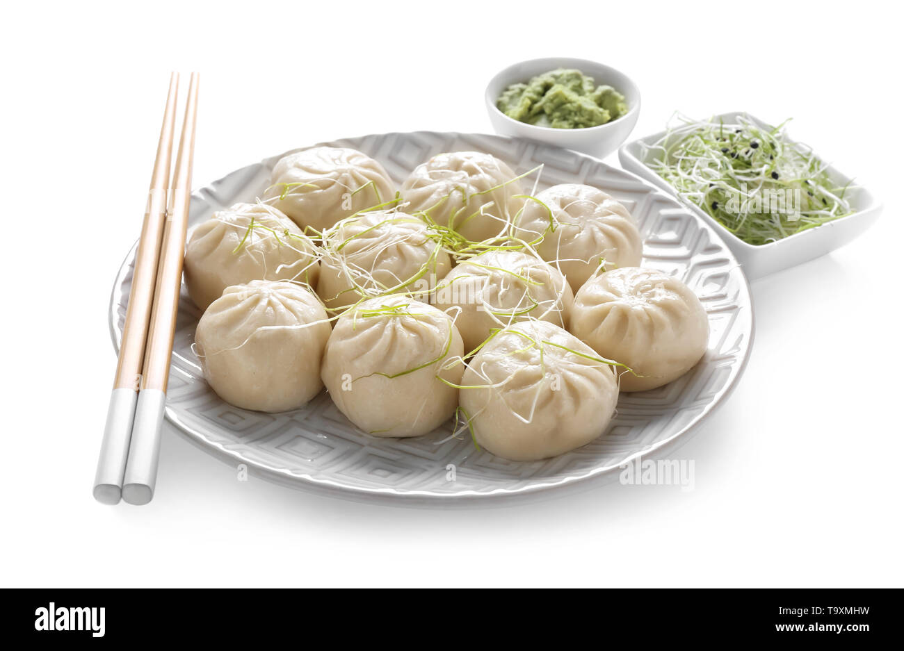 Plate with tasty Chinese dumplings, wasabi and sprouts on white ...