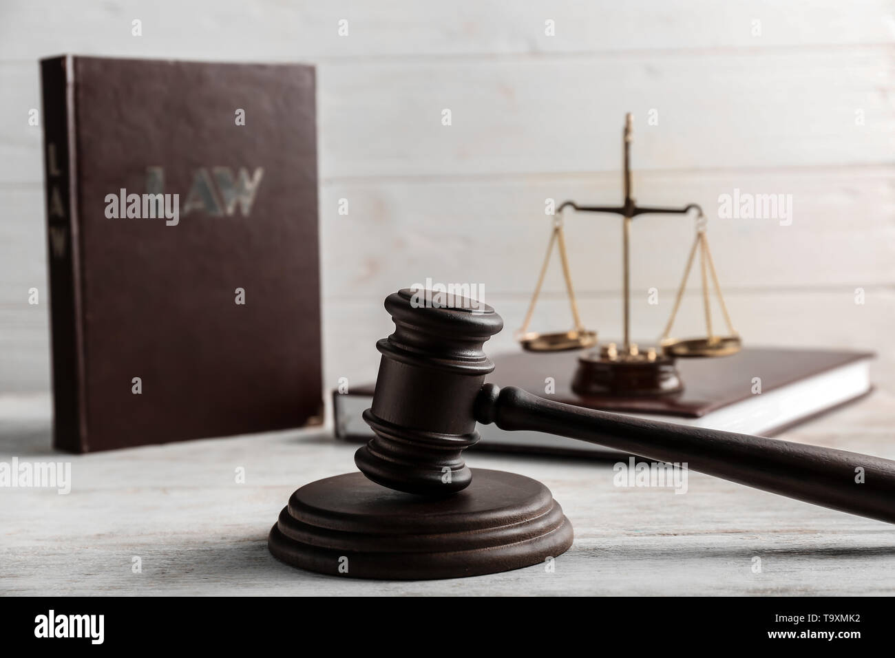 Judge's gavel on wooden table Stock Photo - Alamy
