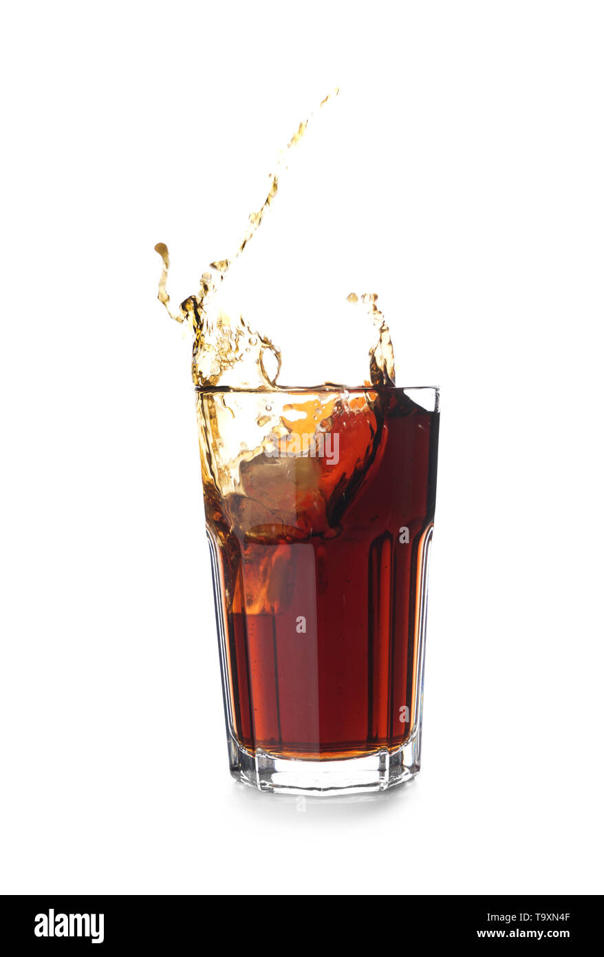 Glass of tasty soda with splash on white background Stock Photo - Alamy