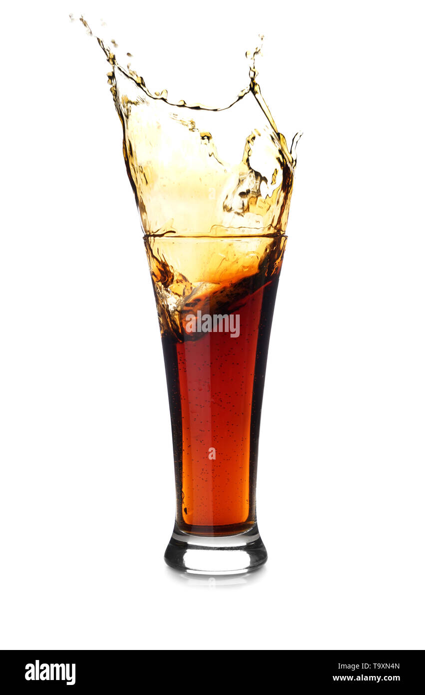 Glass of tasty soda with splash on white background Stock Photo - Alamy