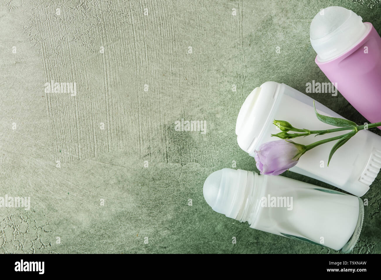 Different deodorants on color background Stock Photo - Alamy