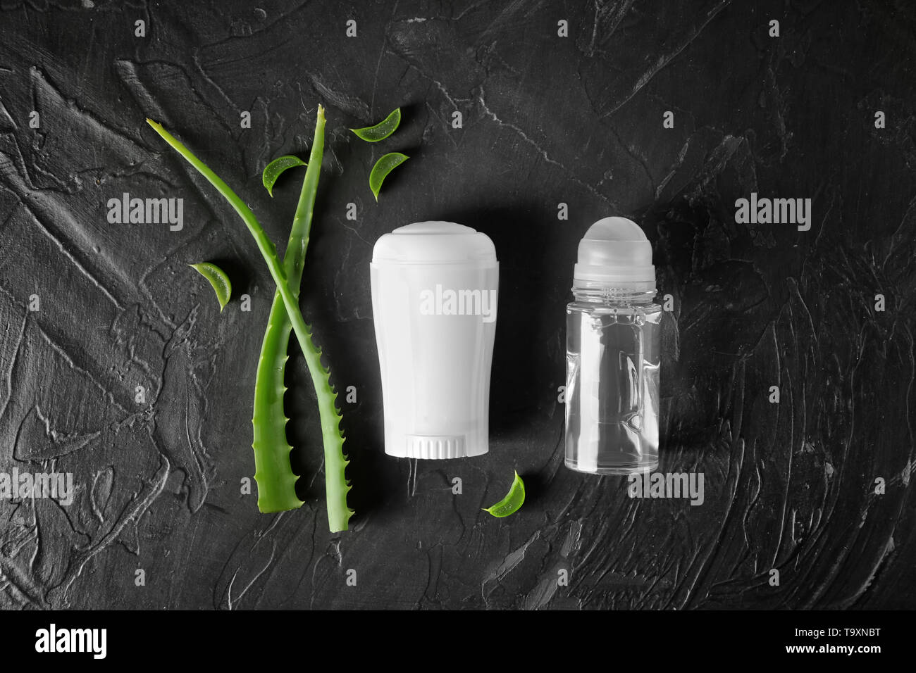 Deodorants with aloe vera extract on dark background Stock Photo - Alamy