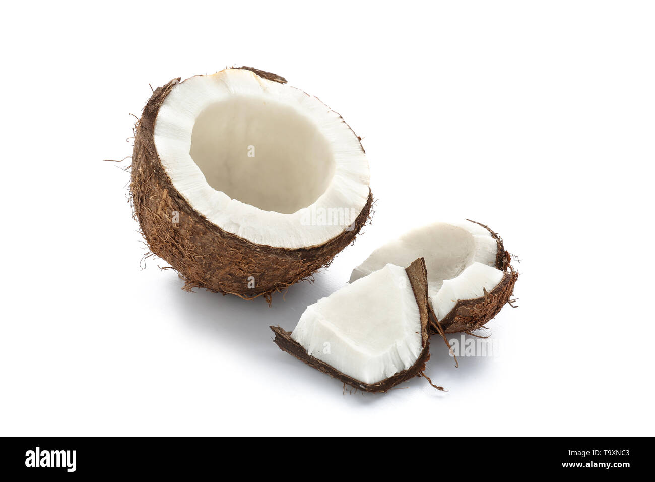 Cut ripe coconut on white background Stock Photo - Alamy