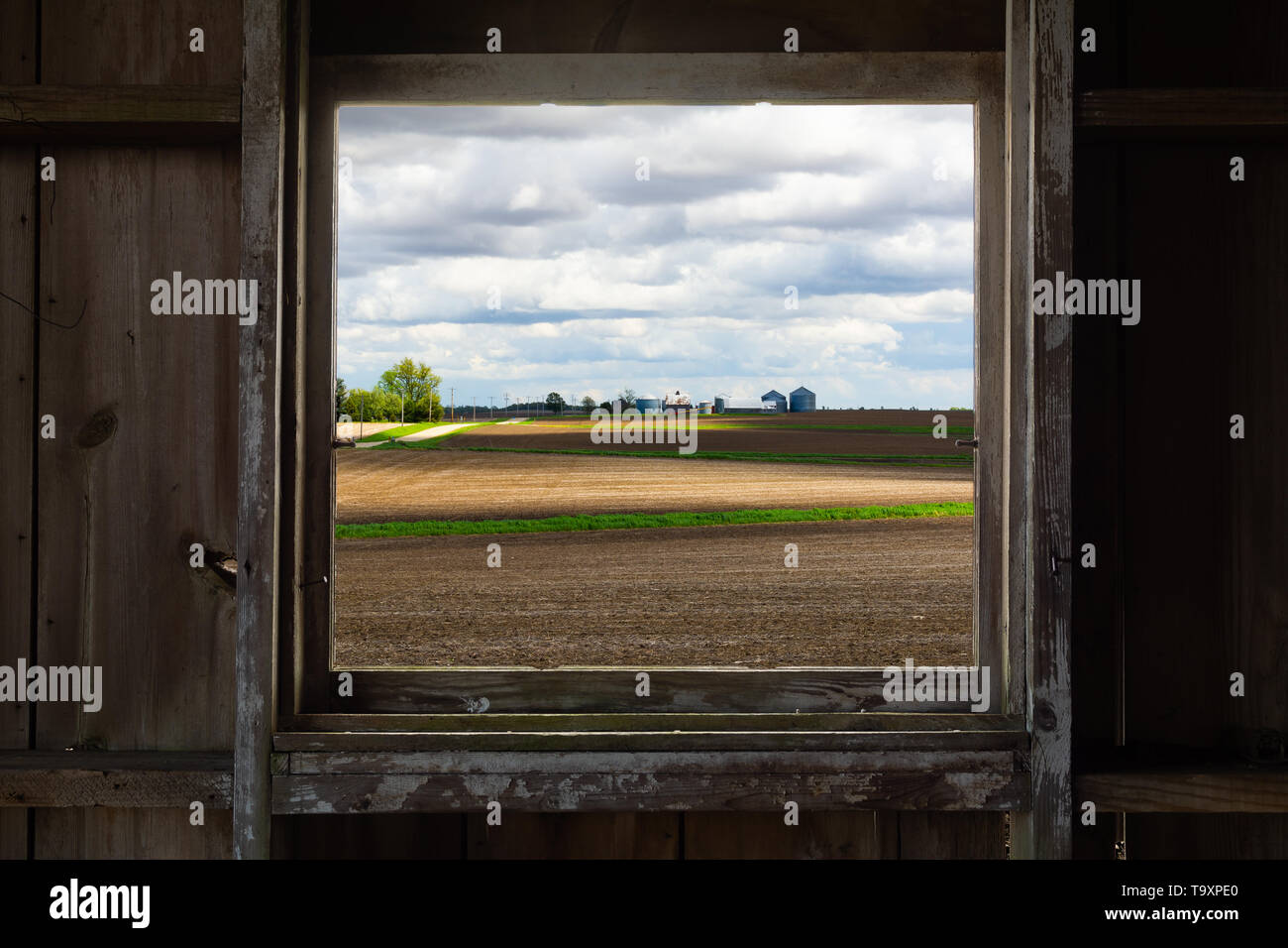 view through the barn window over the Midwest countryside Stock Photo ...