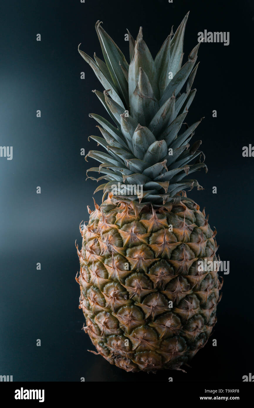 pineapple on an isolated black background Stock Photo - Alamy