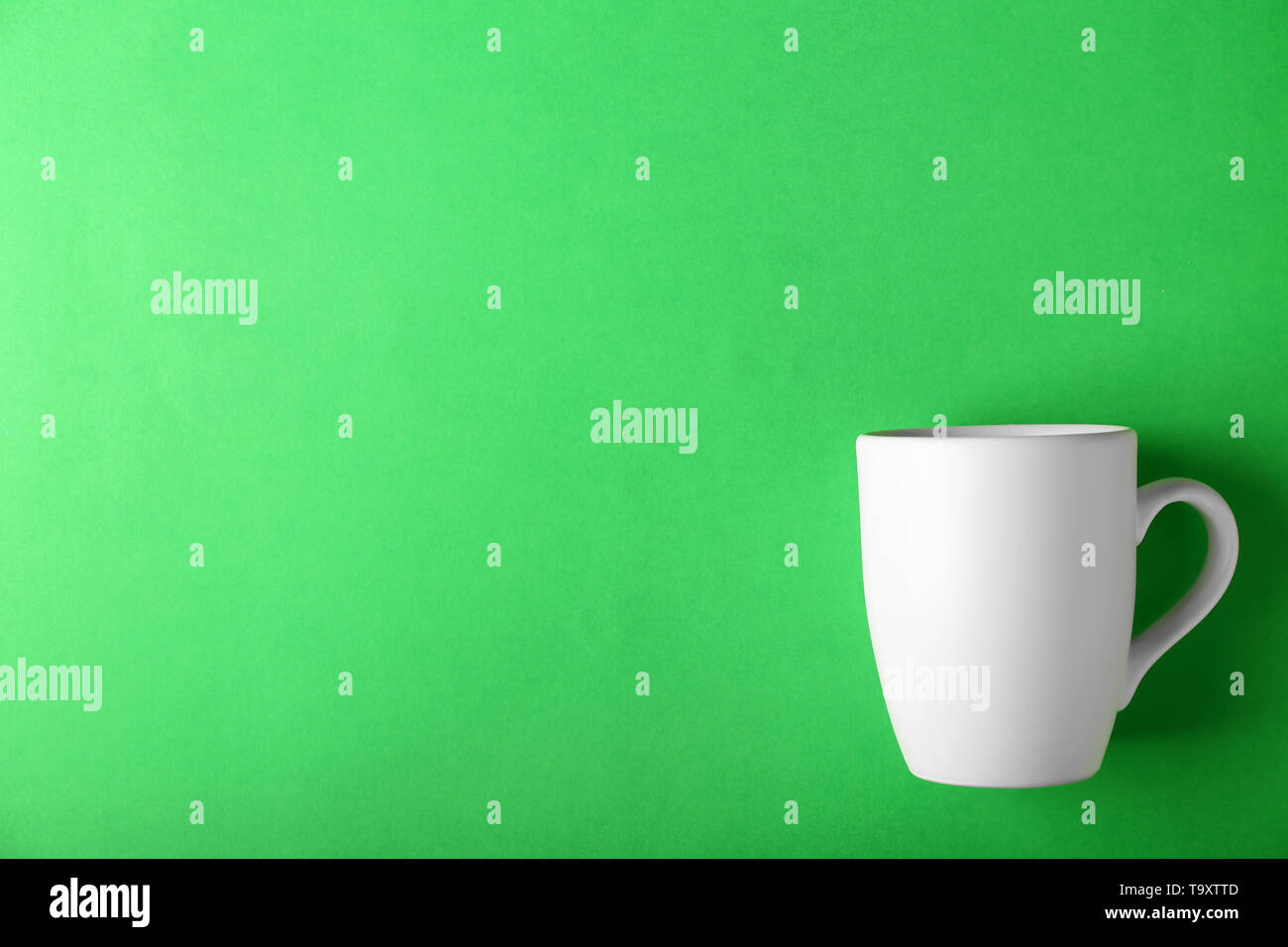 Blank cup for branding on color background Stock Photo - Alamy