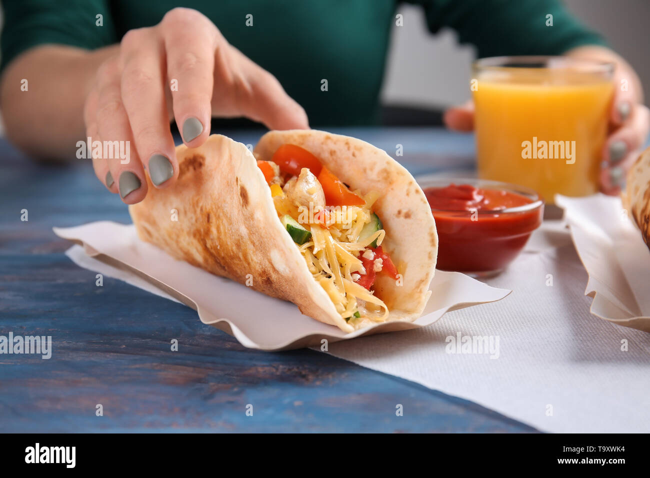 Eating taco woman hi-res stock photography and images - Alamy