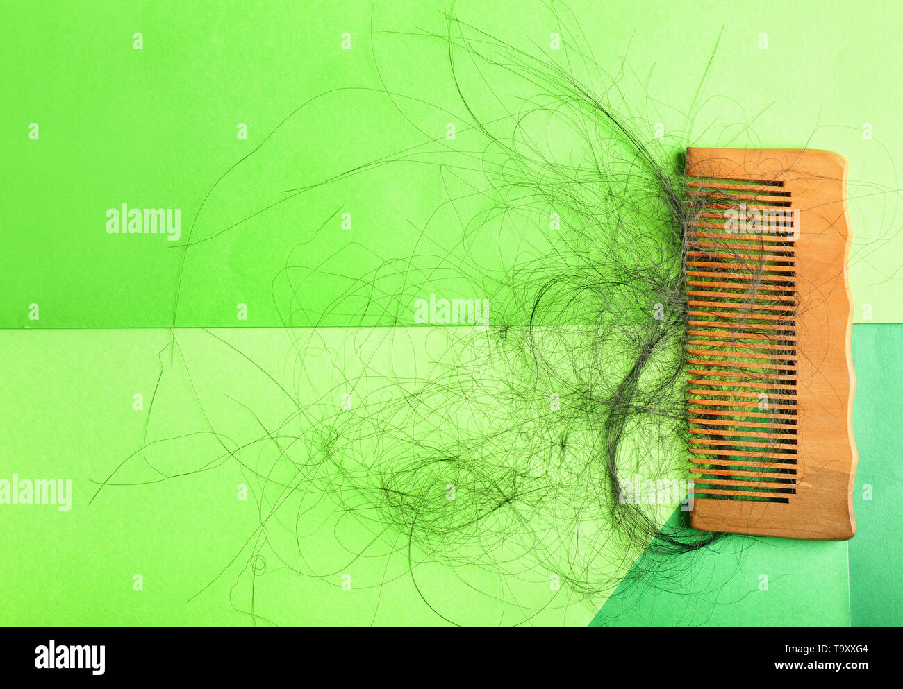 Comb with fallen down hair on color background Stock Photo - Alamy