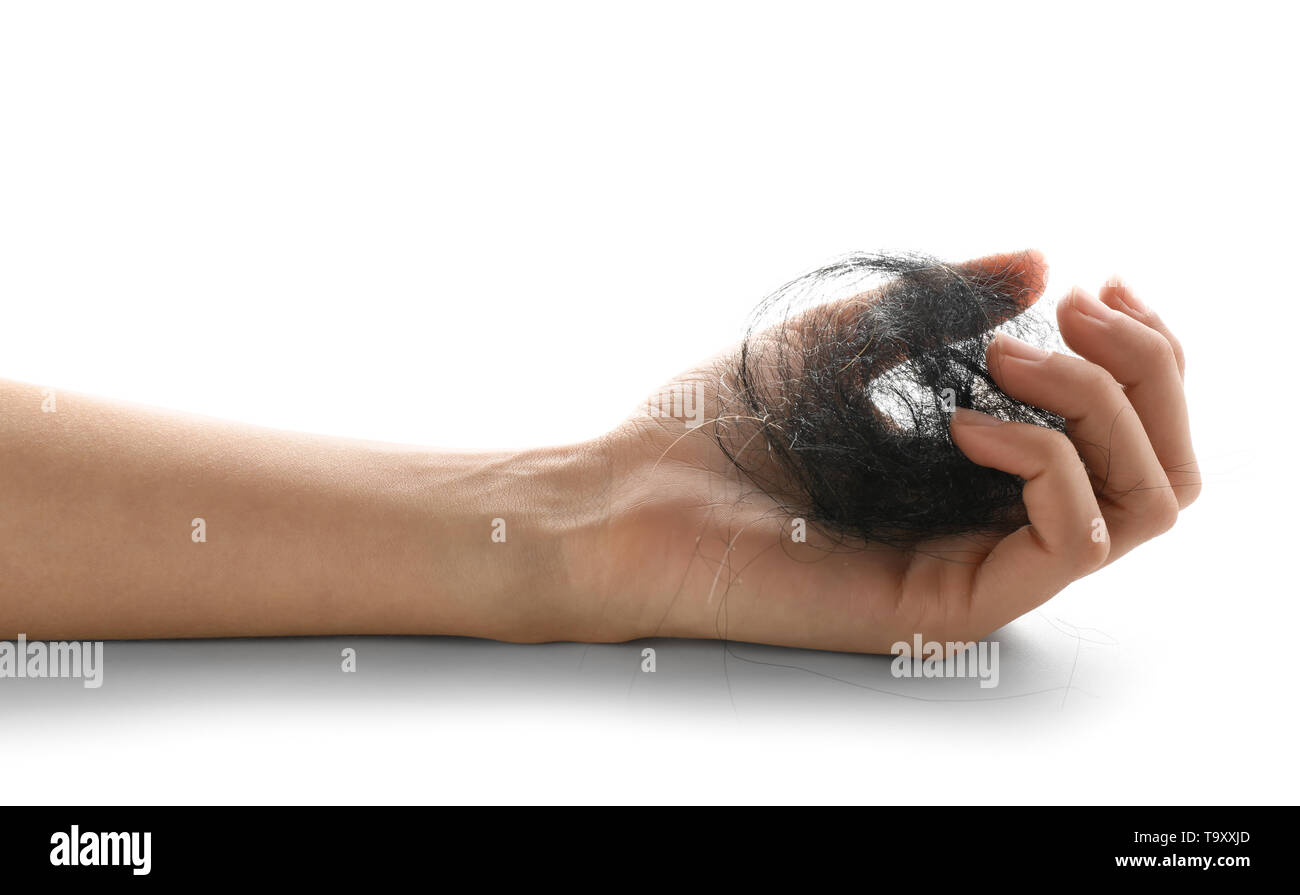 Female hand with fallen down hair on white background Stock Photo - Alamy