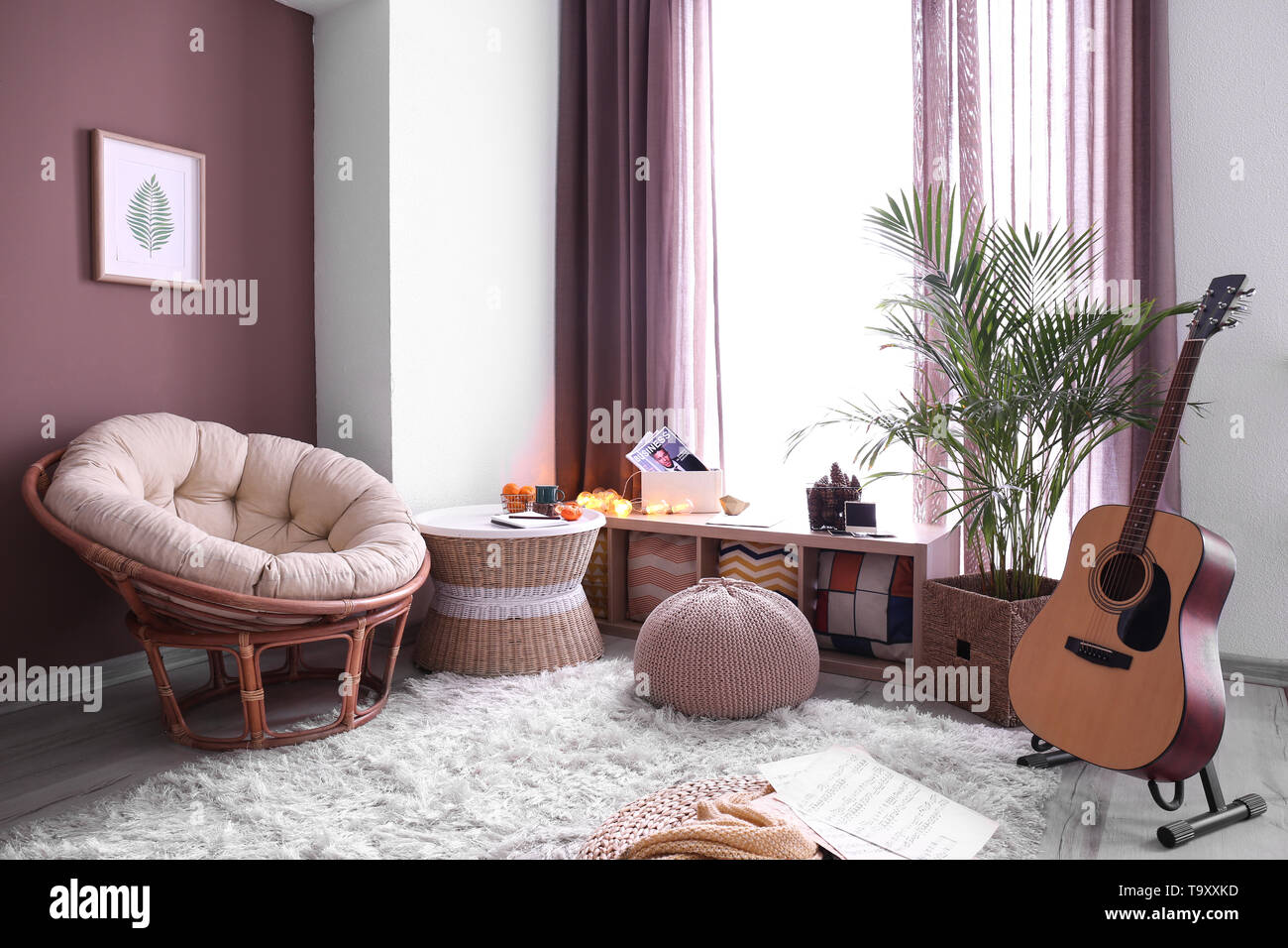 Stylish interior of living room with comfortable lounge armchair Stock ...