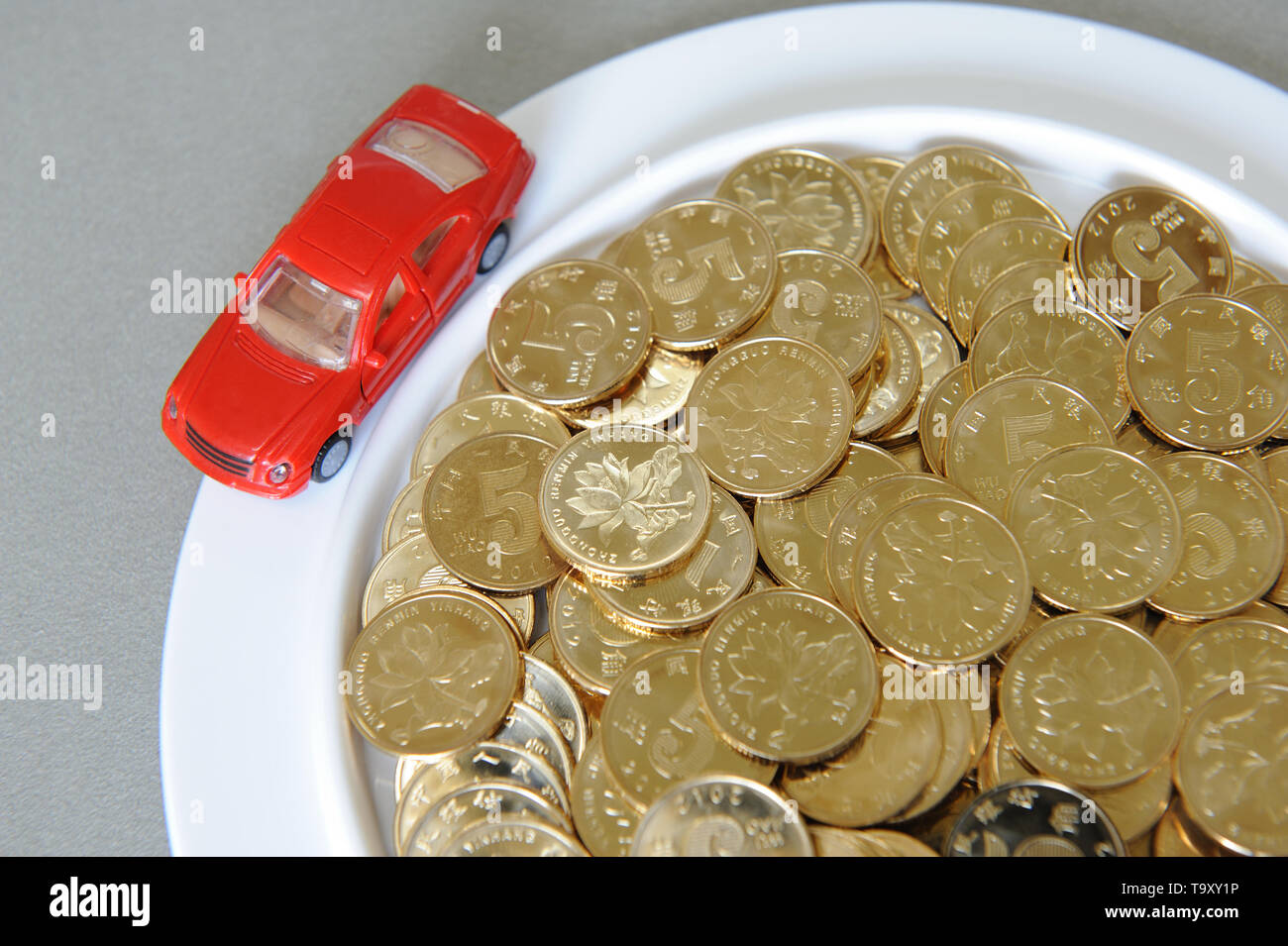 coin and car model Stock Photo - Alamy