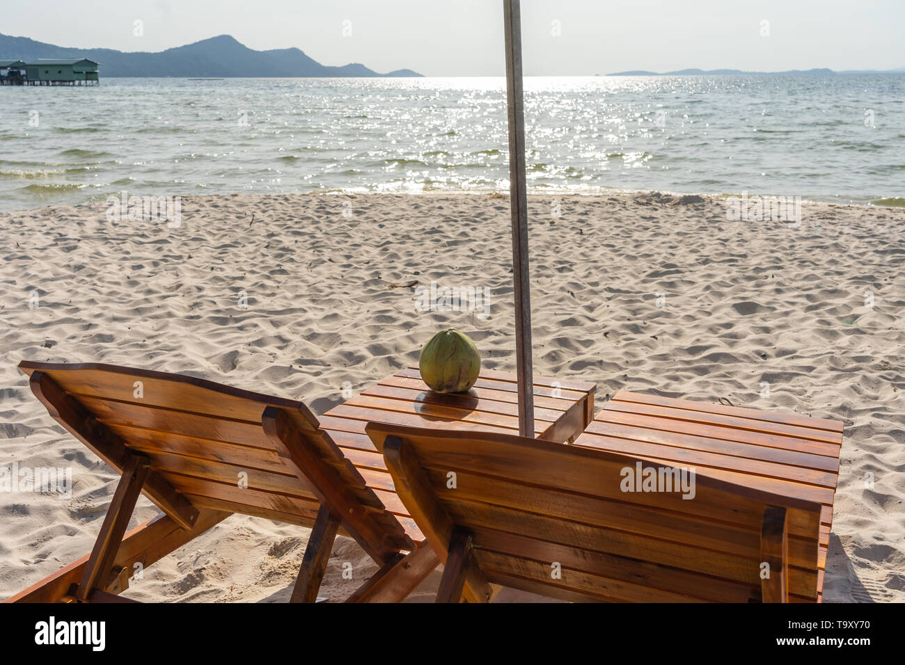 Fresh coconut on the chair at beautiful beach Stock Photo - Alamy