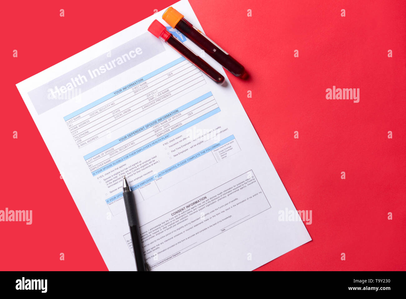 Health insurance form and test-tubes with blood on color background ...
