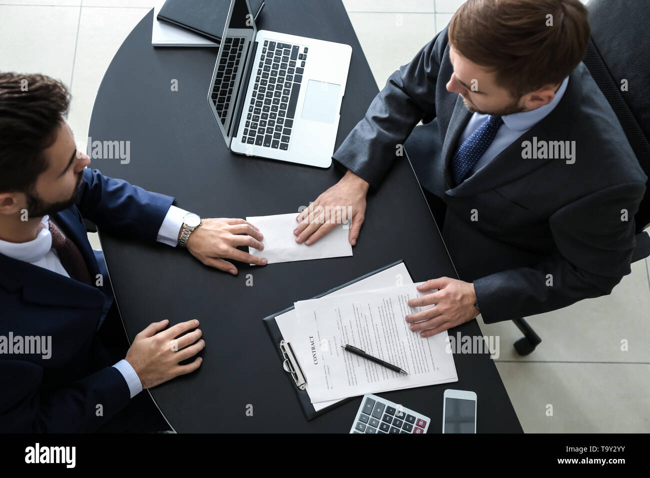 Businessman taking bribe from man in office. Concept of corruption ...