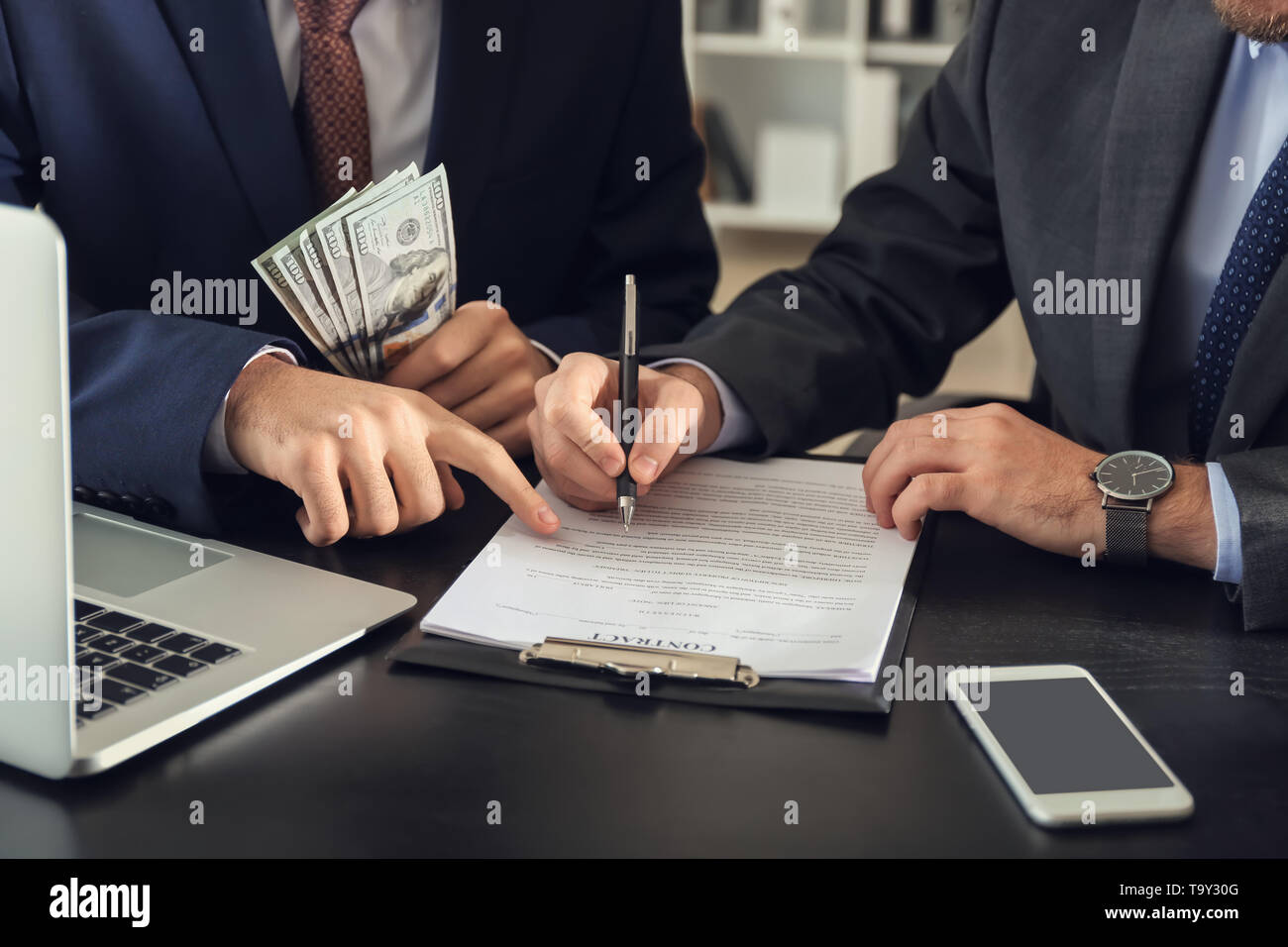 Man giving bribe to businessman in office. Concept of corruption Stock ...